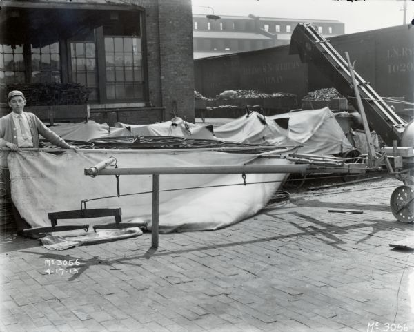 Young Man and Farm Implement in Factory Yard | Photograph | Wisconsin ...