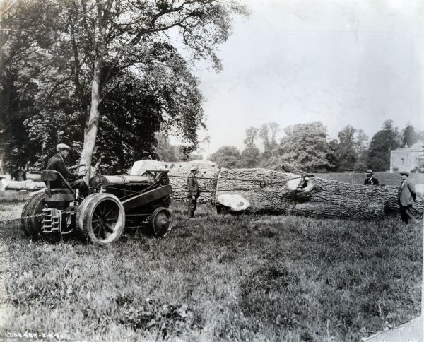 Moving Large Log with Tractor in England | Photograph | Wisconsin ...