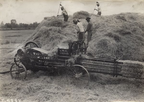 Men Baling Hay | Photograph | Wisconsin Historical Society