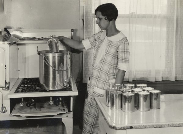 Woman Demonstrating Canning | Photograph | Wisconsin Historical Society