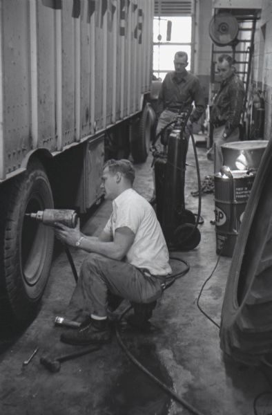 Mechanic Fixes Truck at Truck Stop | Photograph | Wisconsin Historical ...