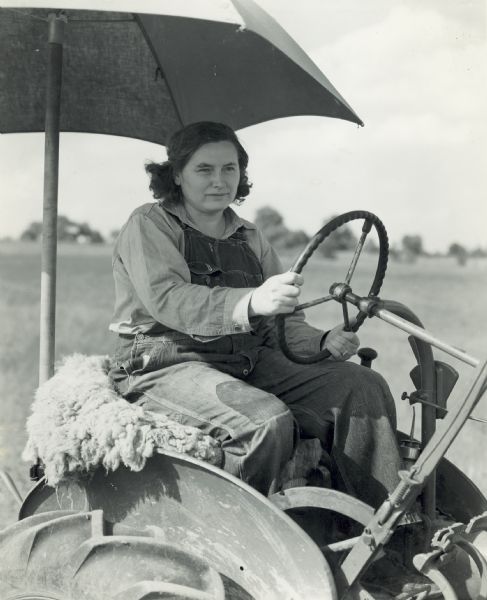Mrs. Mabel Arbogast Driving a Farmall A | Photograph | Wisconsin ...