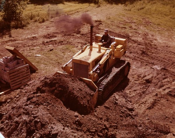 Man Operating 250 Loader | Photograph | Wisconsin Historical Society