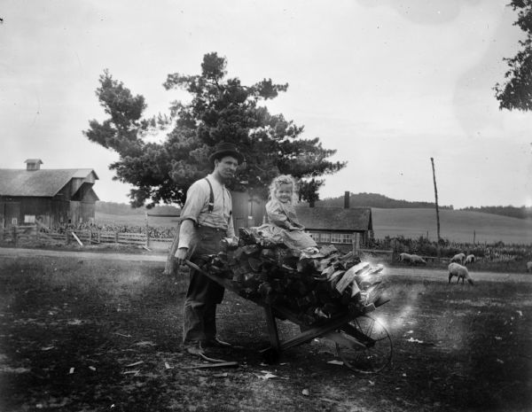 Young Girl Riding in Wheelbarrow | Photograph | Wisconsin Historical ...