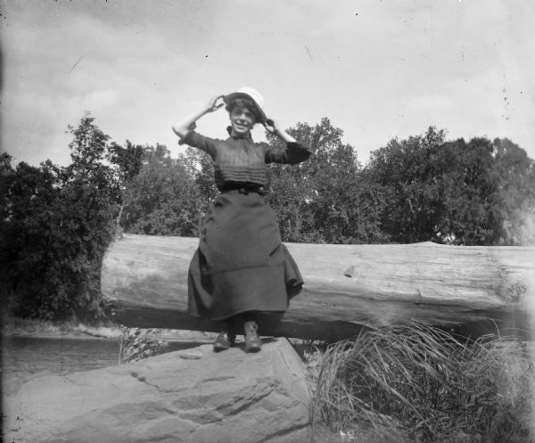 Woman Sitting on Log | Photograph | Wisconsin Historical Society