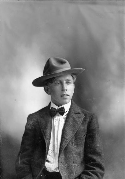 Young Ho-Chunk Man Posed Sitting | Photograph | Wisconsin Historical ...