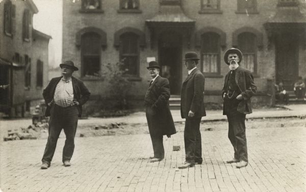 Four Men Standing on Street | Photograph | Wisconsin Historical Society