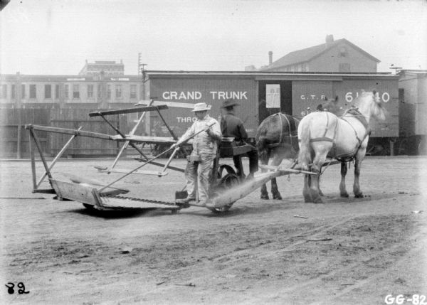 Two Men on a Horse-Drawn Reaper in Factory Yard | Photograph ...