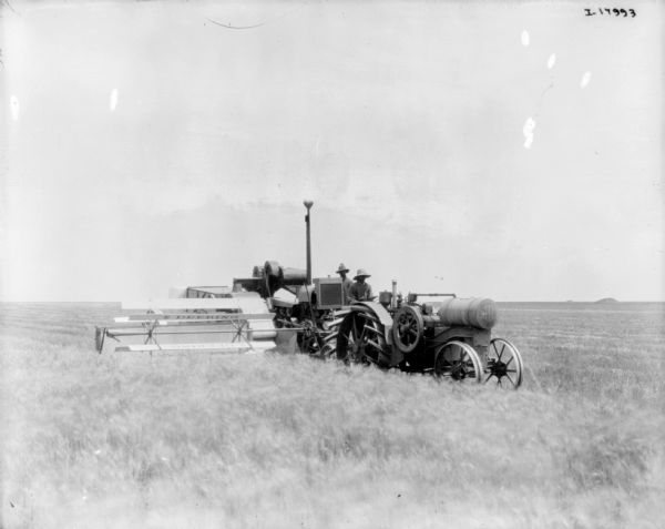Titan Tractor Pulling Harvester Thresher in Field | Photograph ...