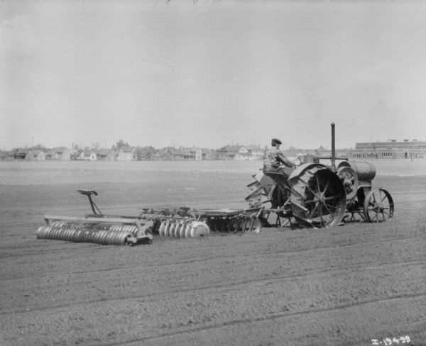 Man Using Titan Tractor to Pull Disk Harrow and Soil Pulverizer ...