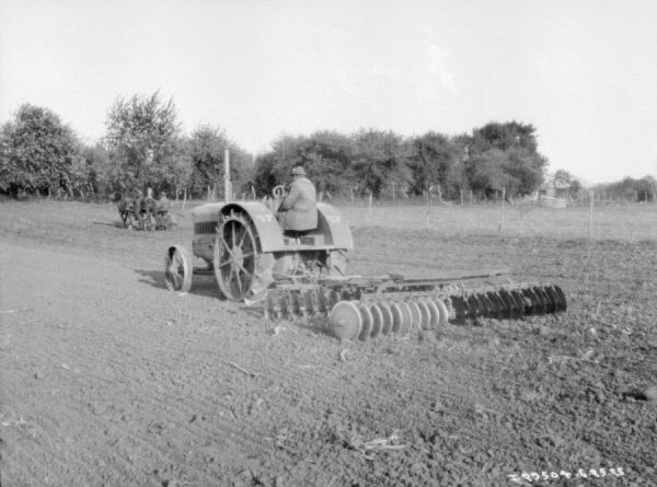 Man on Tractor Pulling Disk Harrow | Photograph | Wisconsin Historical ...