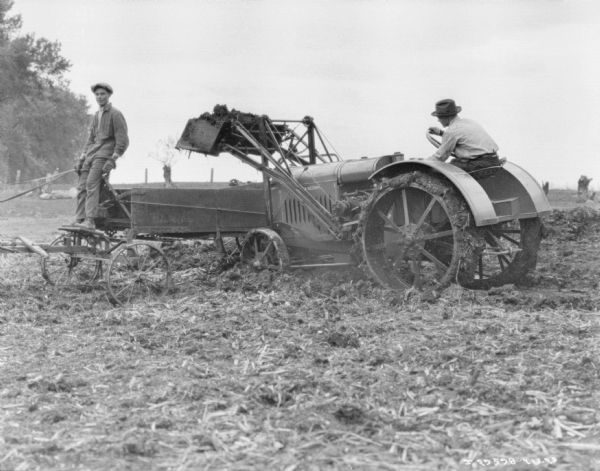 Filling Manure Spreader | Photograph | Wisconsin Historical Society