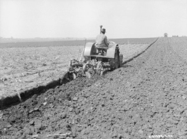 Man Using Tractor to Pull Plow | Photograph | Wisconsin Historical Society