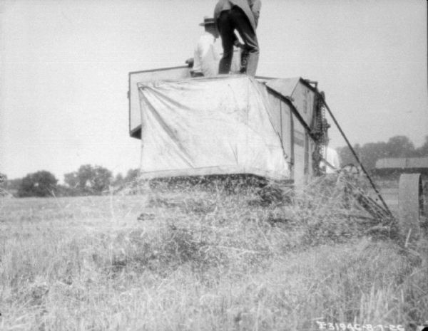 Thresher Operation in Field | Photograph | Wisconsin Historical Society