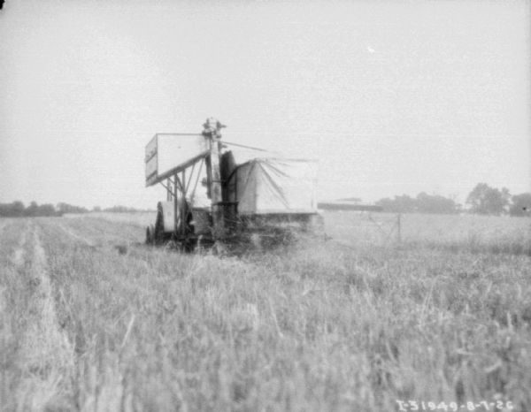 Thresher Operation in Field | Photograph | Wisconsin Historical Society
