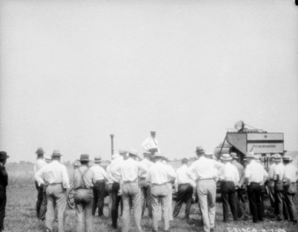 Thresher Operation in Field | Photograph | Wisconsin Historical Society