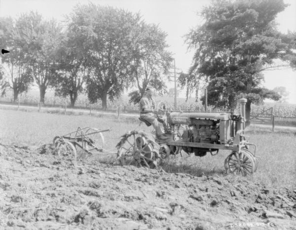Man Driving Farmall Tractor Pulling Plow | Photograph | Wisconsin ...