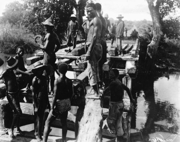 Group of African Men Building Bridge | Photograph | Wisconsin ...