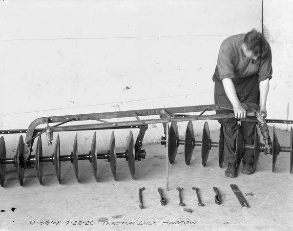 Man Adjusting Tractor Disc Harrow | Photograph | Wisconsin Historical ...