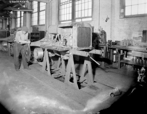 Man Assembling Parts for Farmall Tractor | Photograph | Wisconsin ...