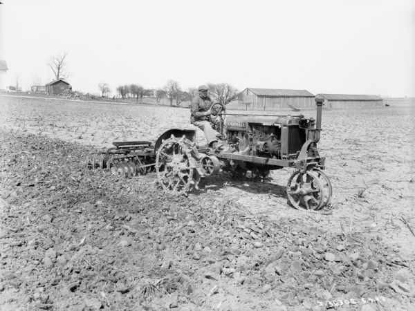 Man Using Farmall Tractor for Disking Field | Photograph | Wisconsin ...