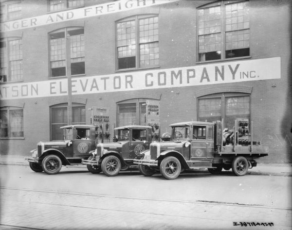 Trucks in front of Watson Elevator Company, Inc. | Photograph ...