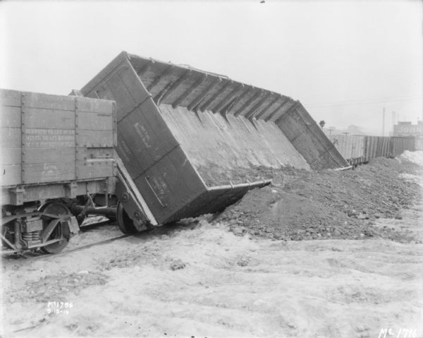 Railroad Car Tipped on Side | Photograph | Wisconsin Historical Society