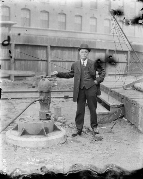 Man in Suit Standing near Fire Hydrant | Photograph | Wisconsin ...