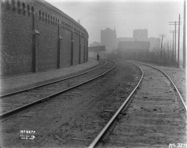 Railroad Tracks Curving Around Round Brick Building | Photograph ...