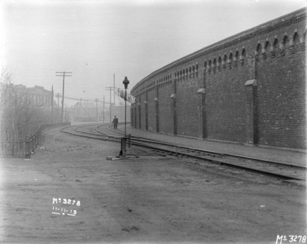 Railroad Tracks Curving Around Round Brick Building | Photograph ...