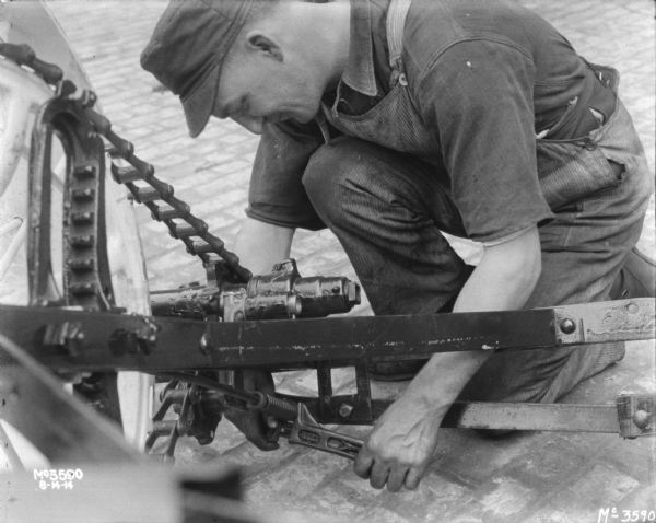 Man Demonstrating Assembly of Parts on Binder | Photograph | Wisconsin ...