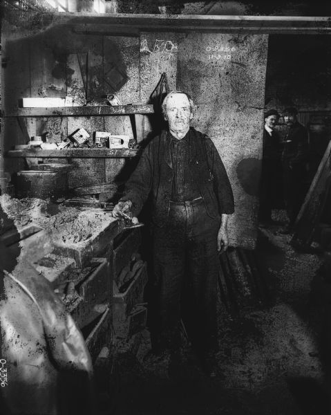 Man in Factory | Photograph | Wisconsin Historical Society