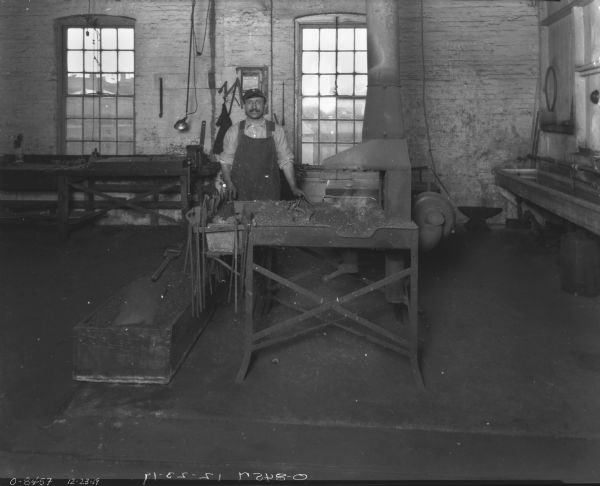 Man in Manufacturing Area | Photograph | Wisconsin Historical Society