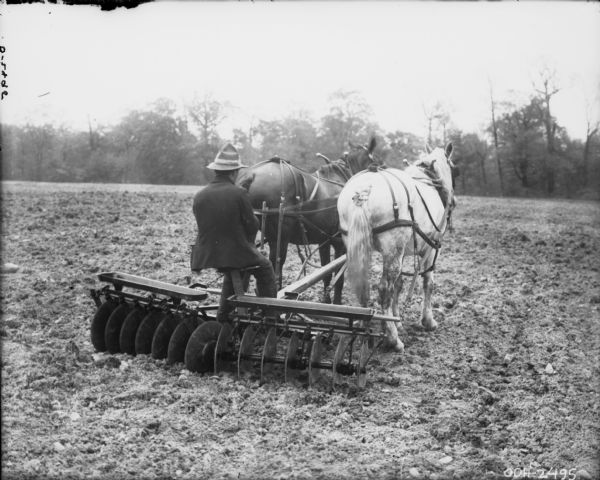 Man on Horse-Drawn Disk Harrow | Photograph | Wisconsin Historical Society