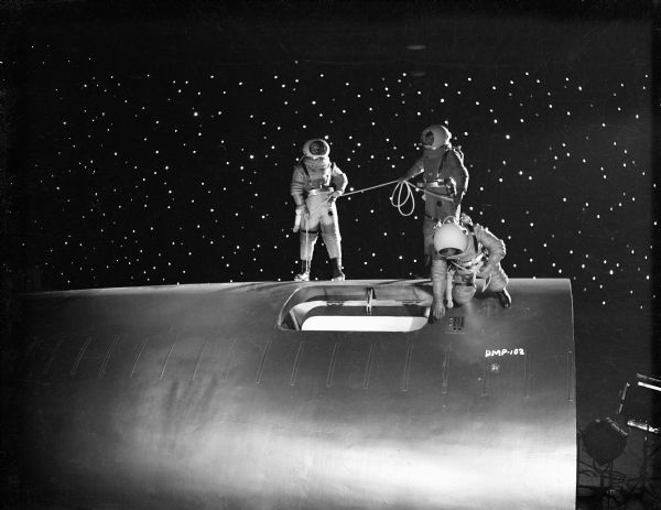Three astronauts spacewalk in a production still for "Destination Moon ...